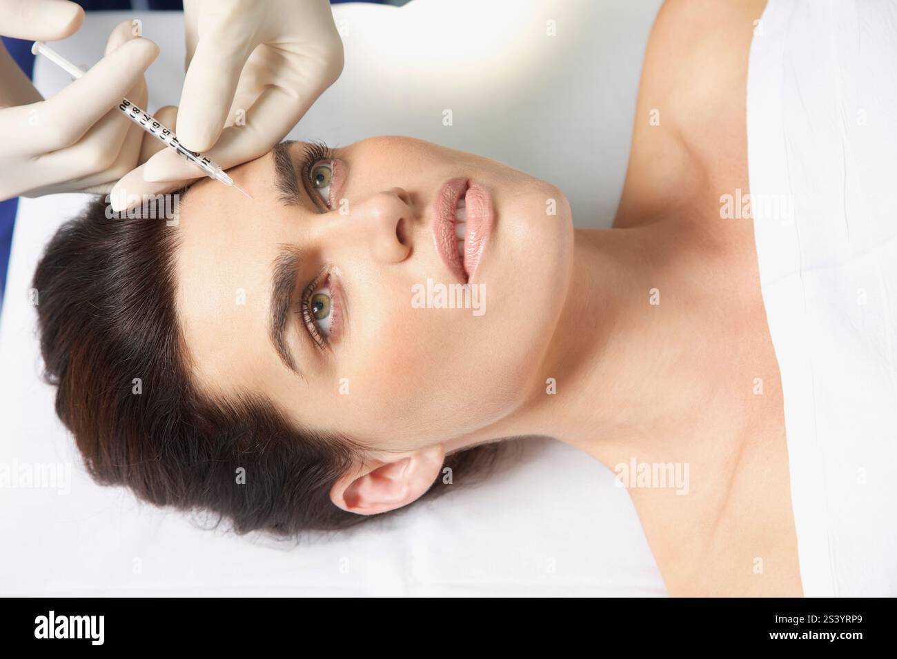 Woman Receiving Botox Injection on Forehead Stock Photo - Alamy