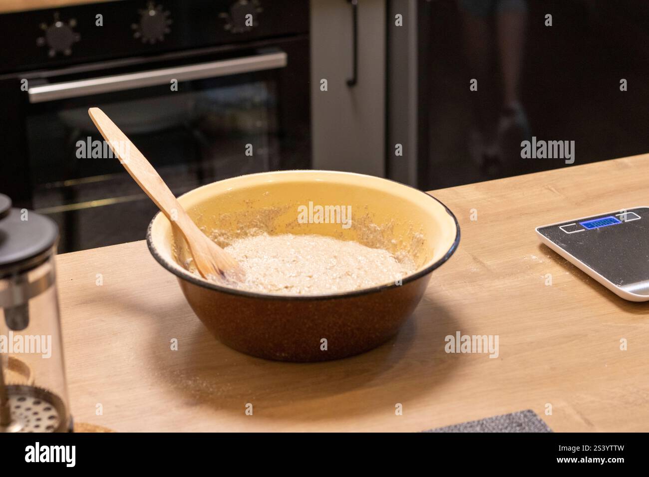 Close up shot of the dough in the bawl on the kitchen counter top Stock ...