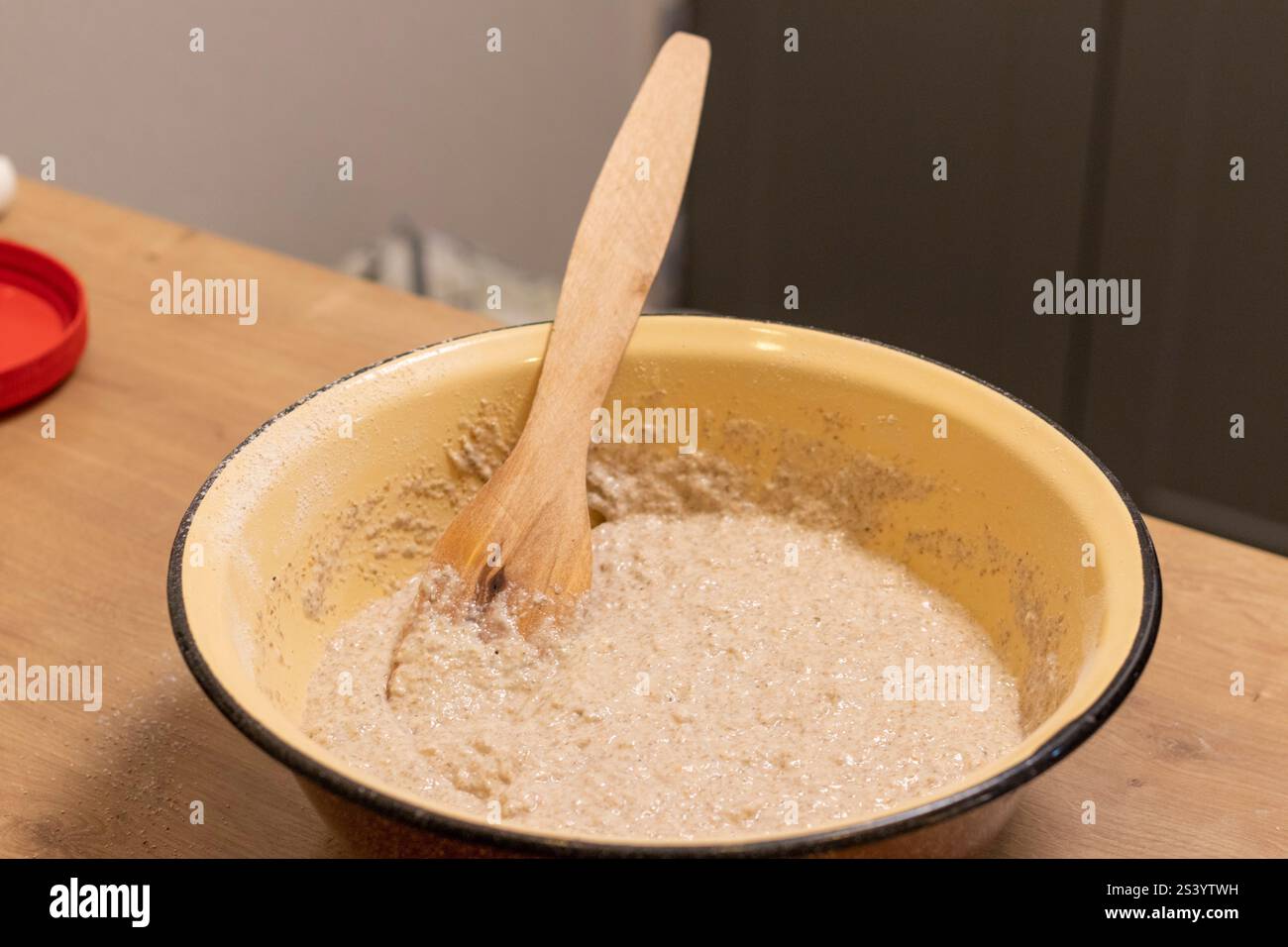 Close up shot of the dough in the bawl on the kitchen counter top Stock ...