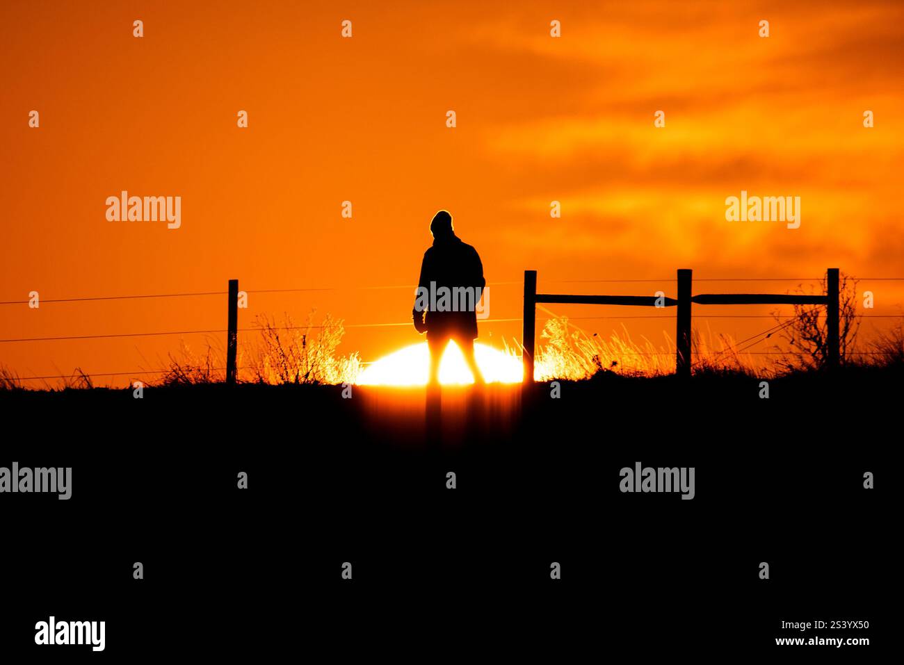 Bingham, Nottinghamshire, UK. 10th January, 2025. A man is silhouetted ...