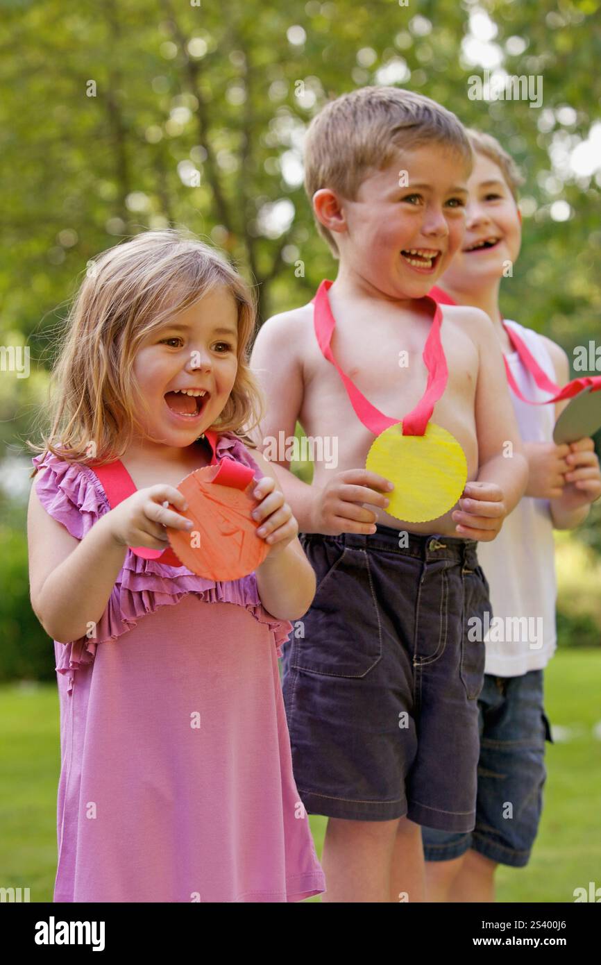 Smiling Children Holding Cardboard Medals Stock Photo - Alamy