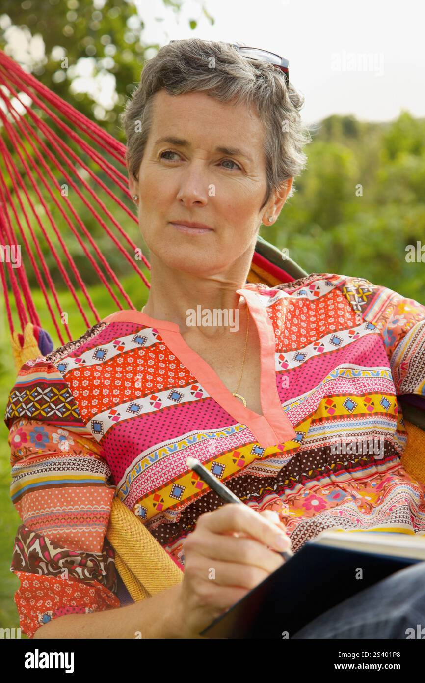Female lying in hammock wearing hi-res stock photography and images - Alamy