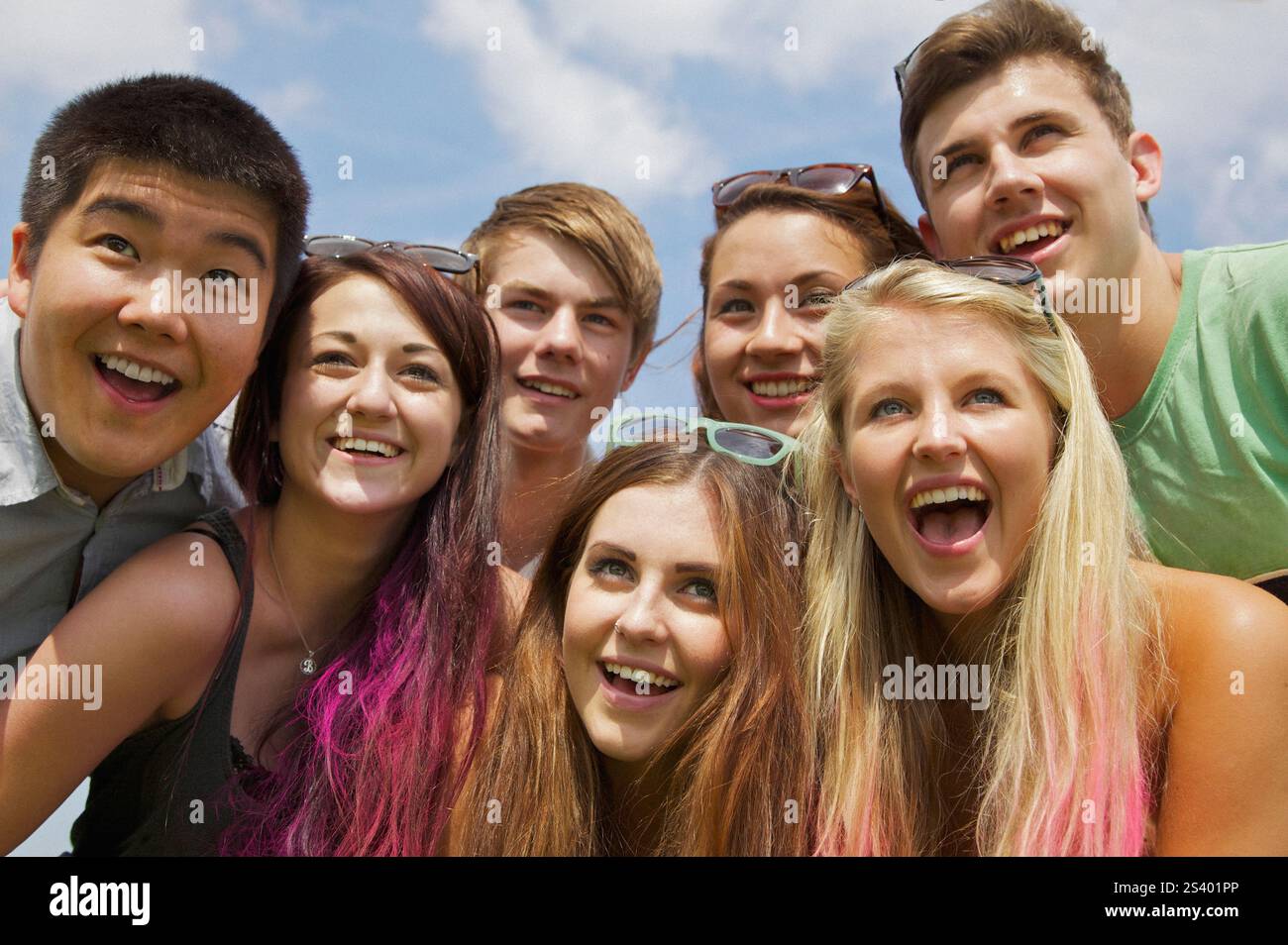 Group of Teenagers Cheering at Music Festival Stock Photo - Alamy