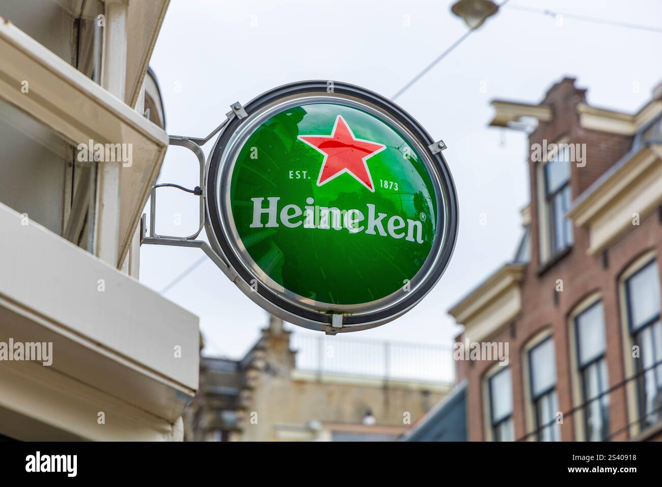 Amsterdam, the Netherlands. 15 June 2024. Heineken sign logo at a cafe ...