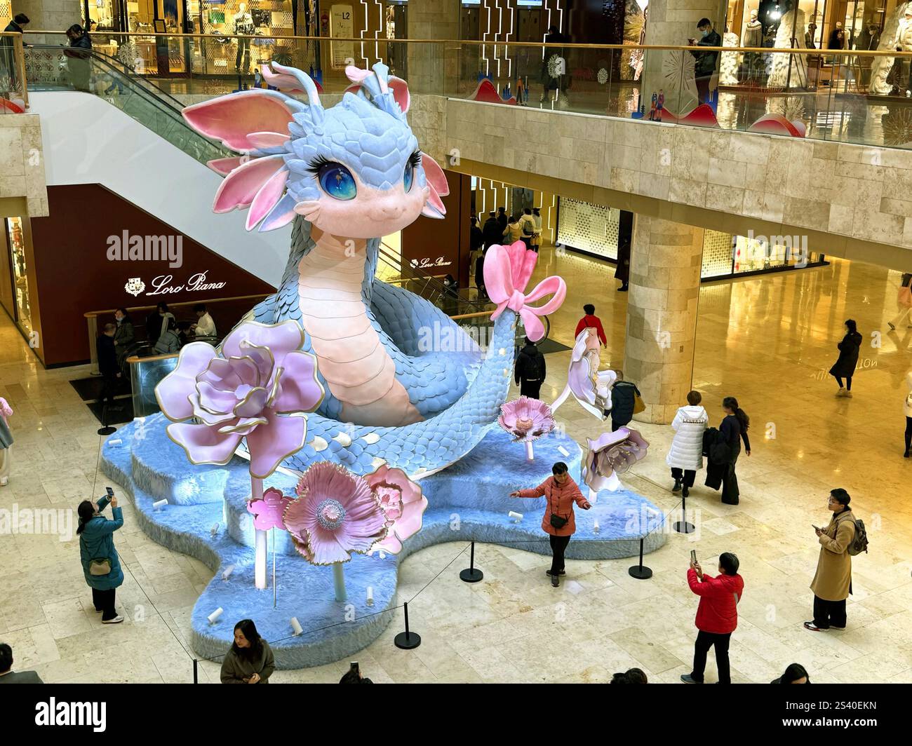 Giant snake decorations are installed in a shopping mall in Nanjing ...