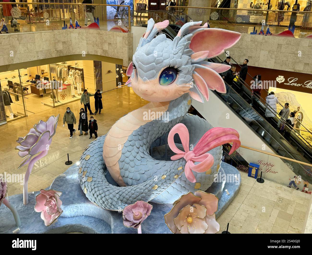 Giant snake decorations are installed in a shopping mall in Nanjing ...
