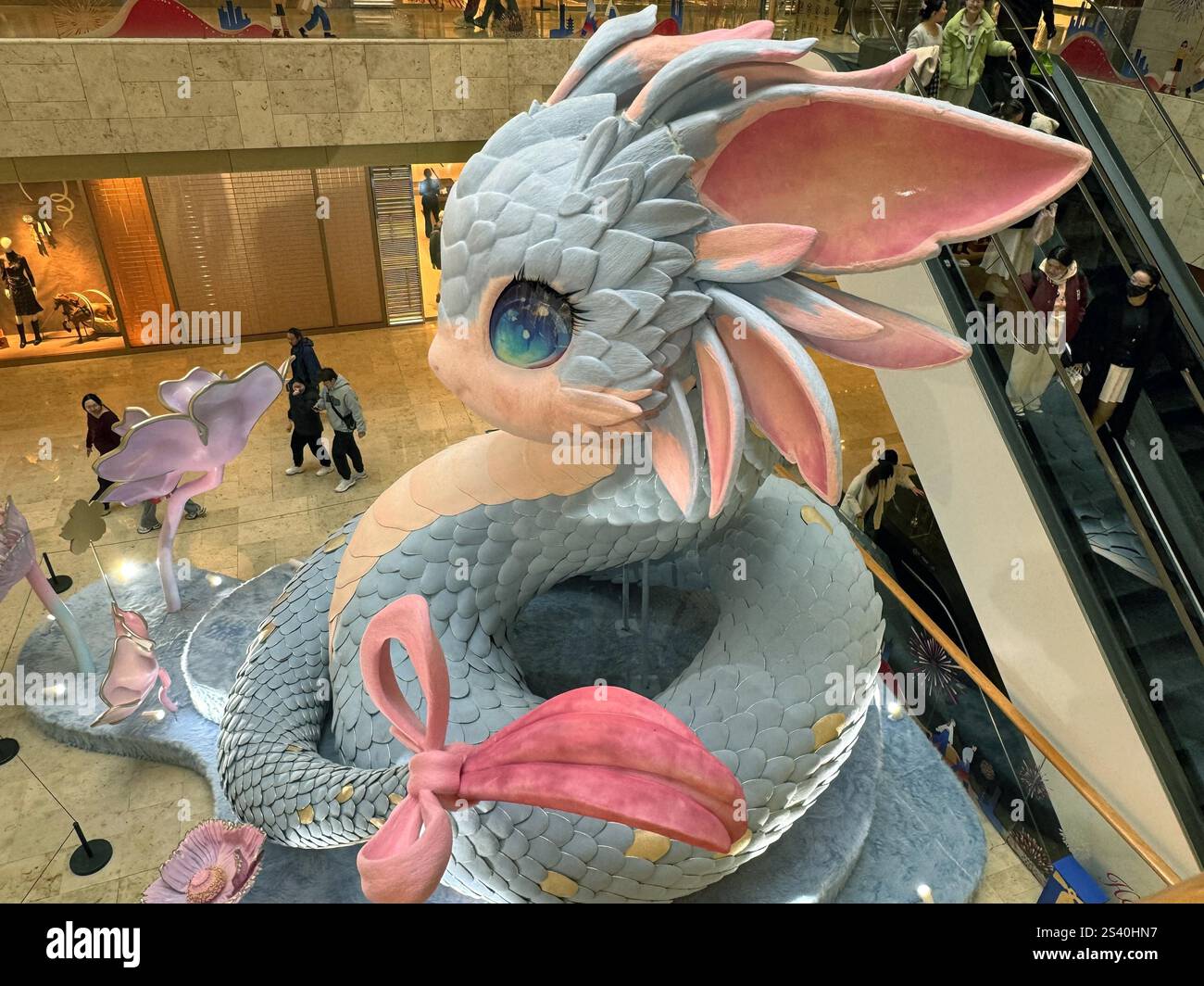 Giant snake decorations are installed in a shopping mall in Nanjing ...