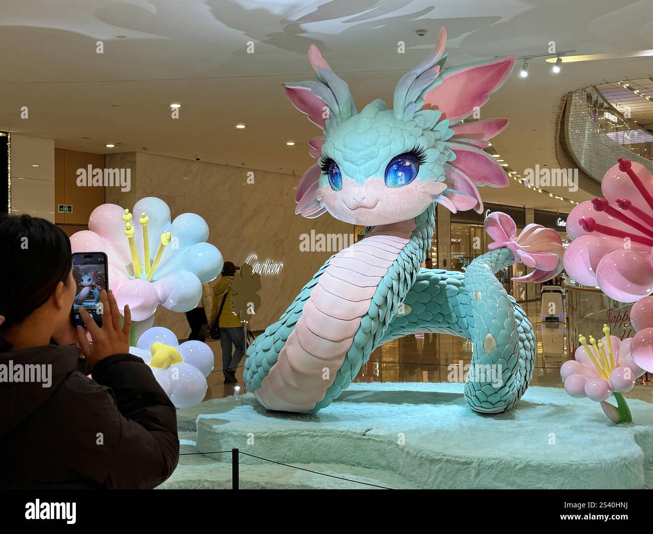 Giant snake decorations are installed in a shopping mall in Nanjing ...