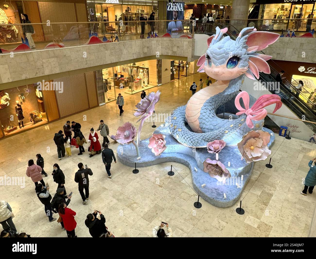Giant snake decorations are installed in a shopping mall in Nanjing ...