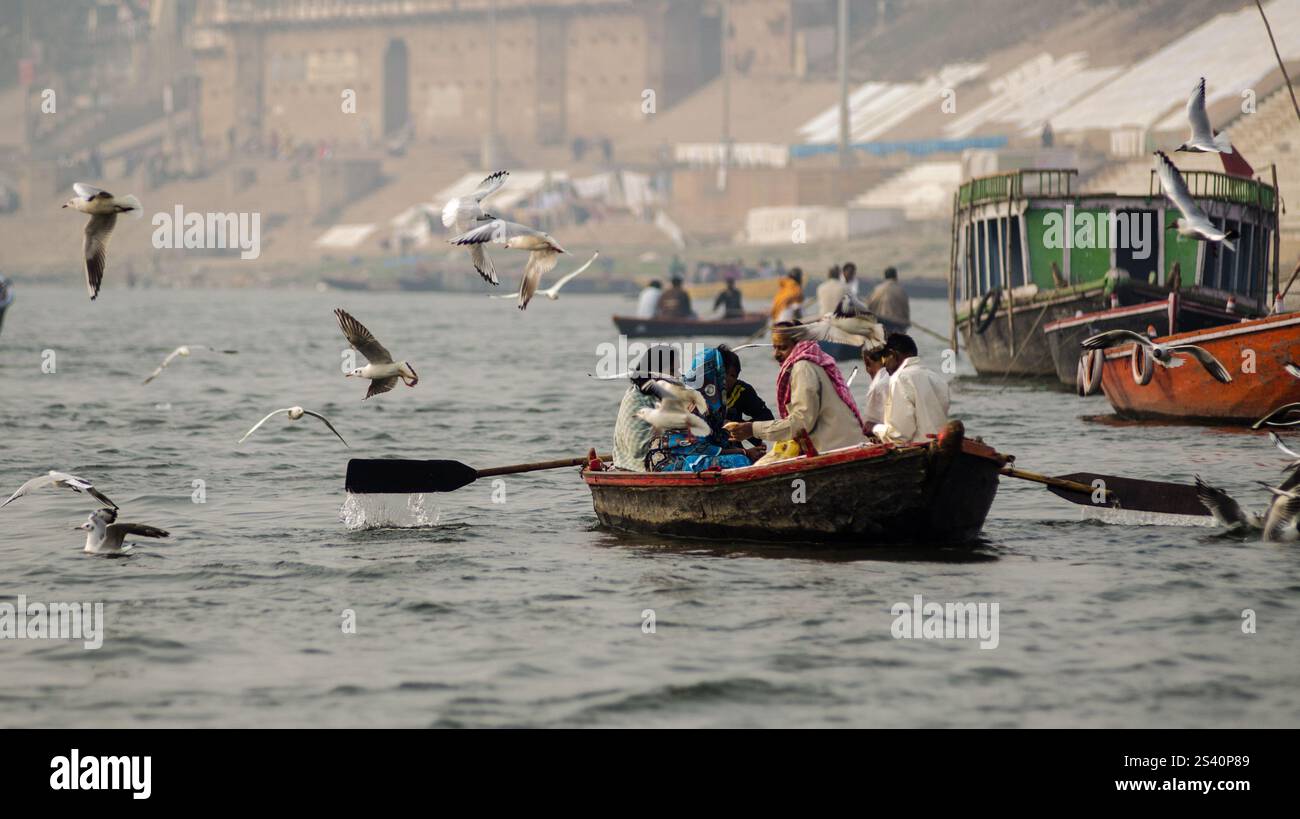 Boats navigate tranquil waters during a traditional river festival in ...