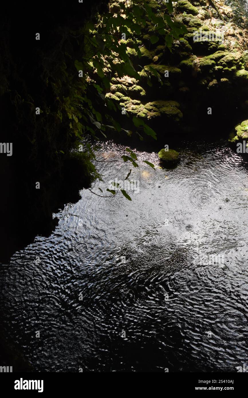 View from above of beautiful water reflecting water in a cave under a ...