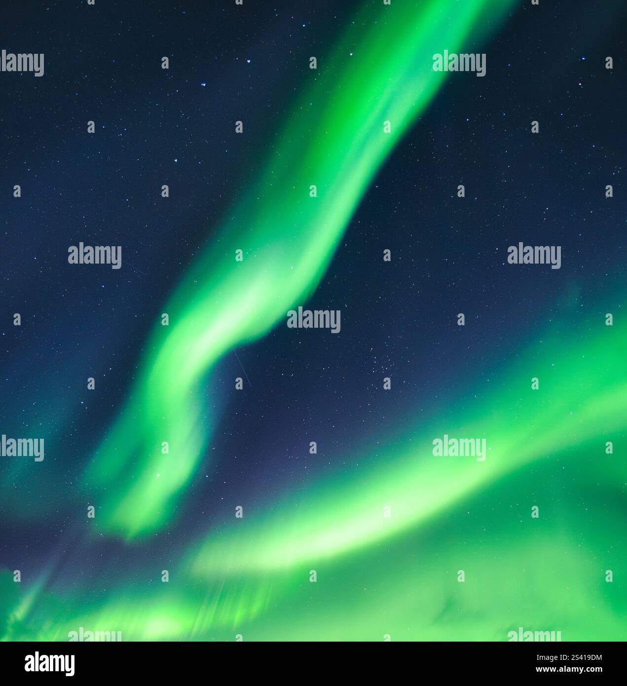 Green color of Aurora Borealis, Northern Lights dancing in blue sky and ...