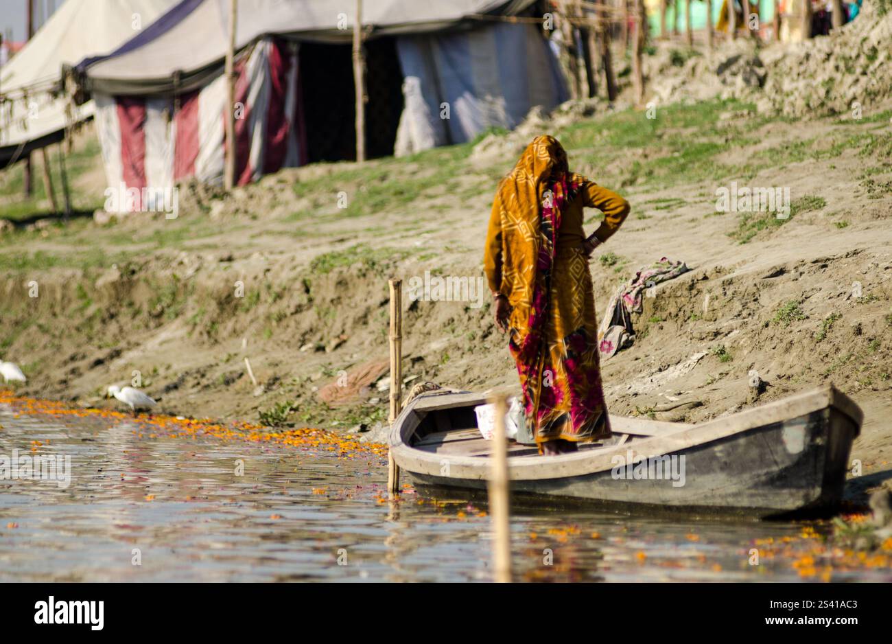 Boats navigate tranquil waters during a traditional river festival in ...