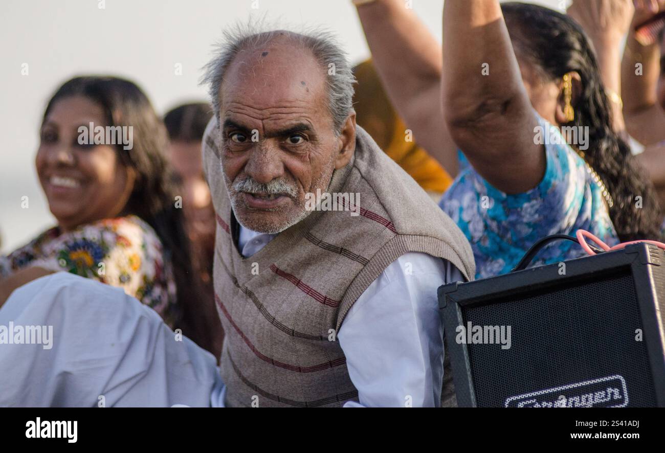 Elderly men in traditional attire gather for spiritual observance ...