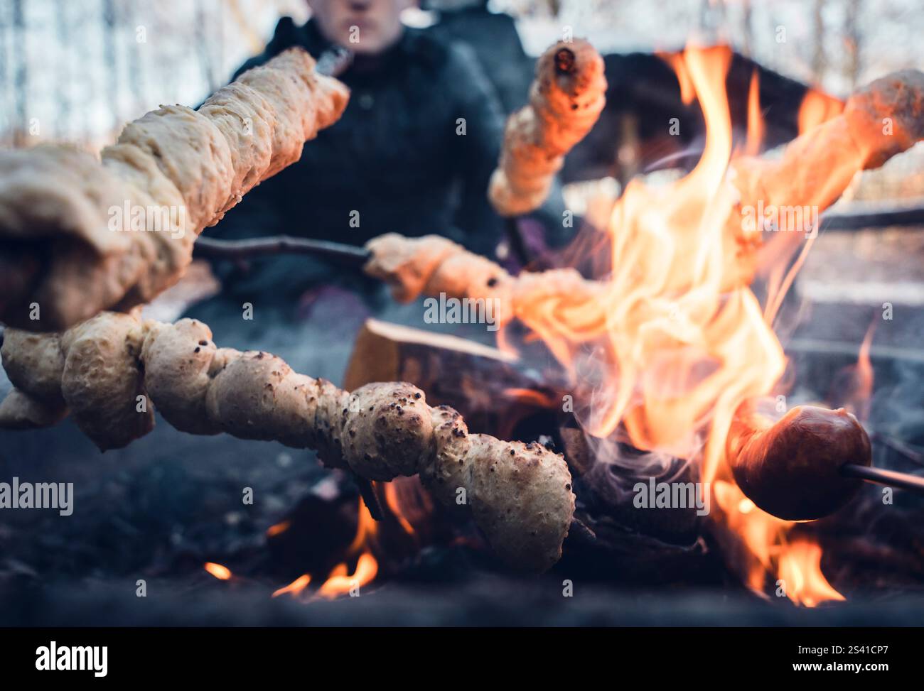 Traditional Danish Campfire Bread Over The Flames Stock Photo - Alamy