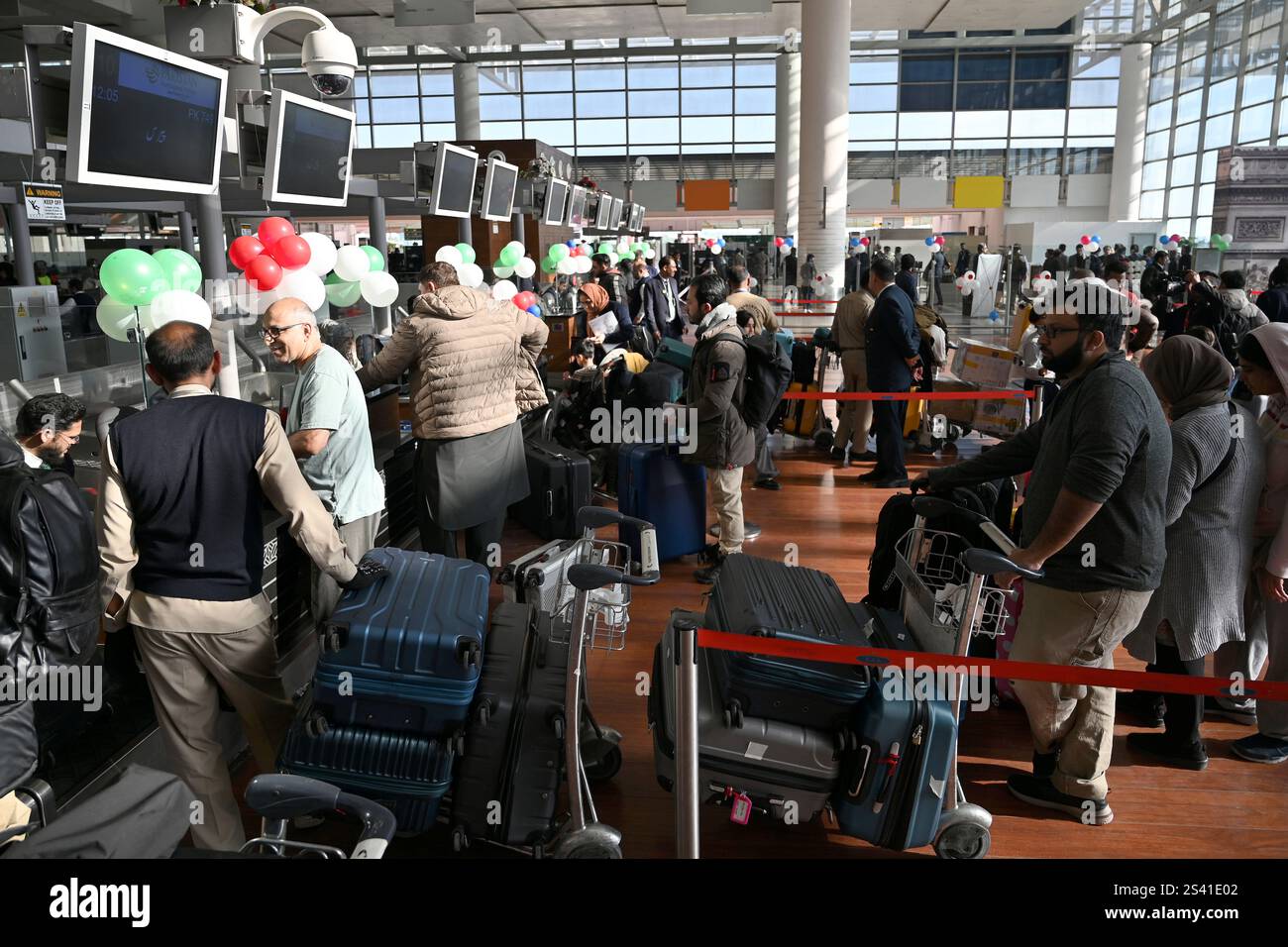 Passengers wait for their boarding in the state-run Pakistan ...