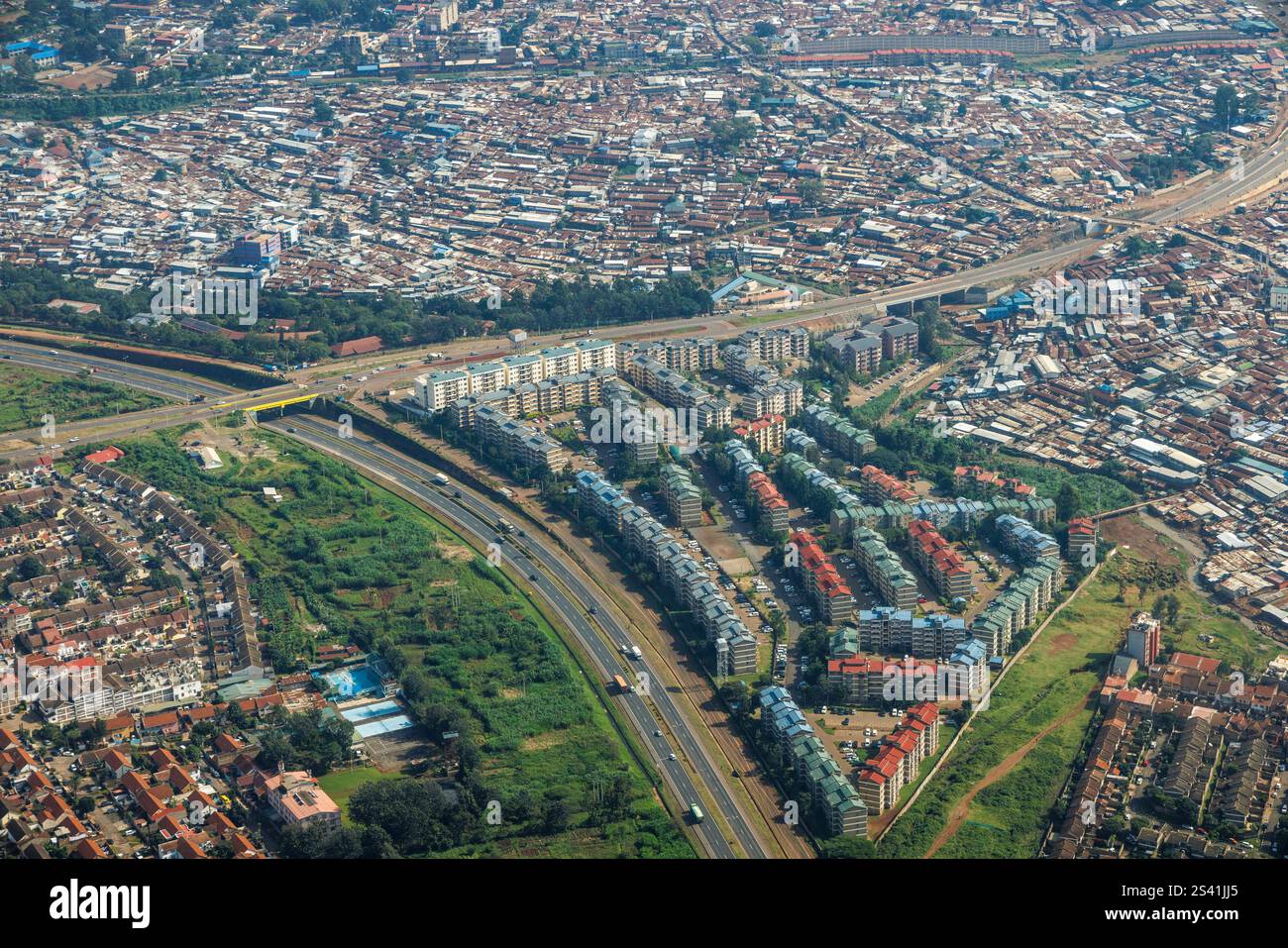Modern housing (bottom) near the Kibera slum (top) in Nairobi Stock ...