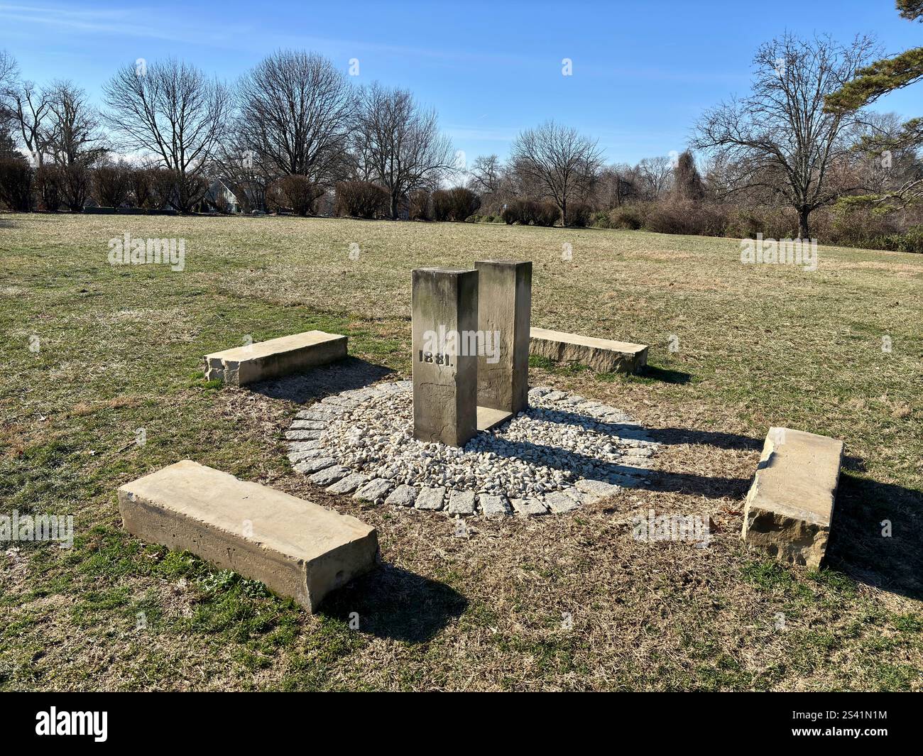 Stone monument engraved with "1881" in open field Stock Photo - Alamy