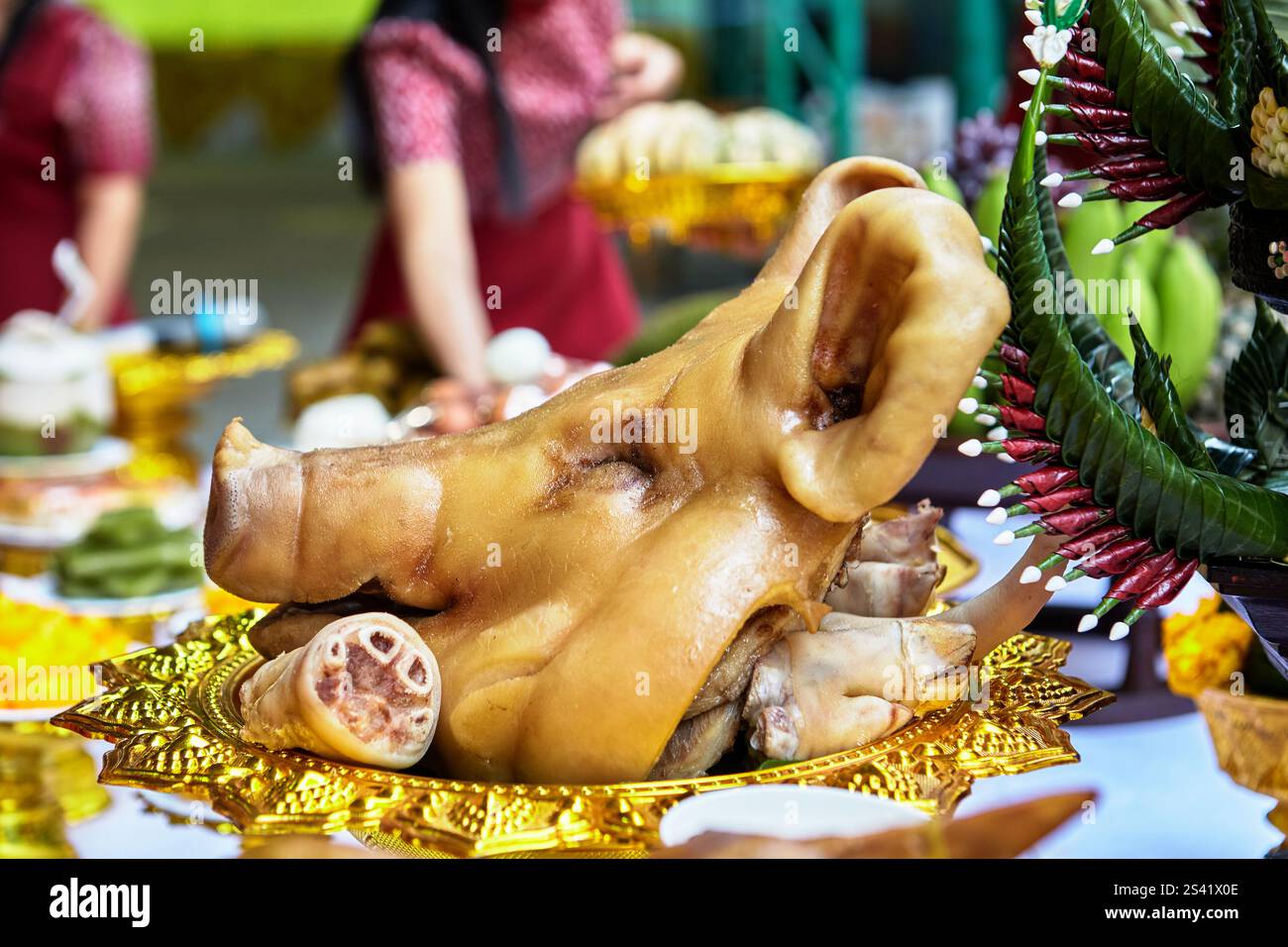 Pigâ€™s head sacrificial offering in god worship Stock Photo - Alamy