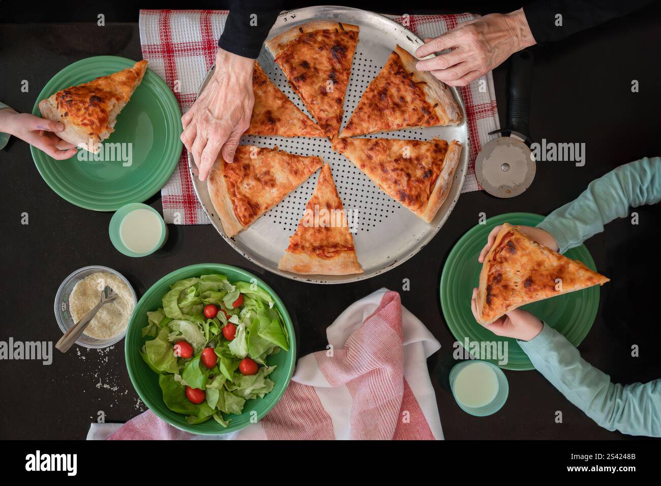 Birds eye view of eating pizza Stock Photo - Alamy