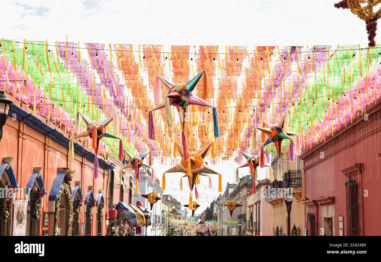 Colorful street in Oaxaca City decorated for traditional festivalss ...