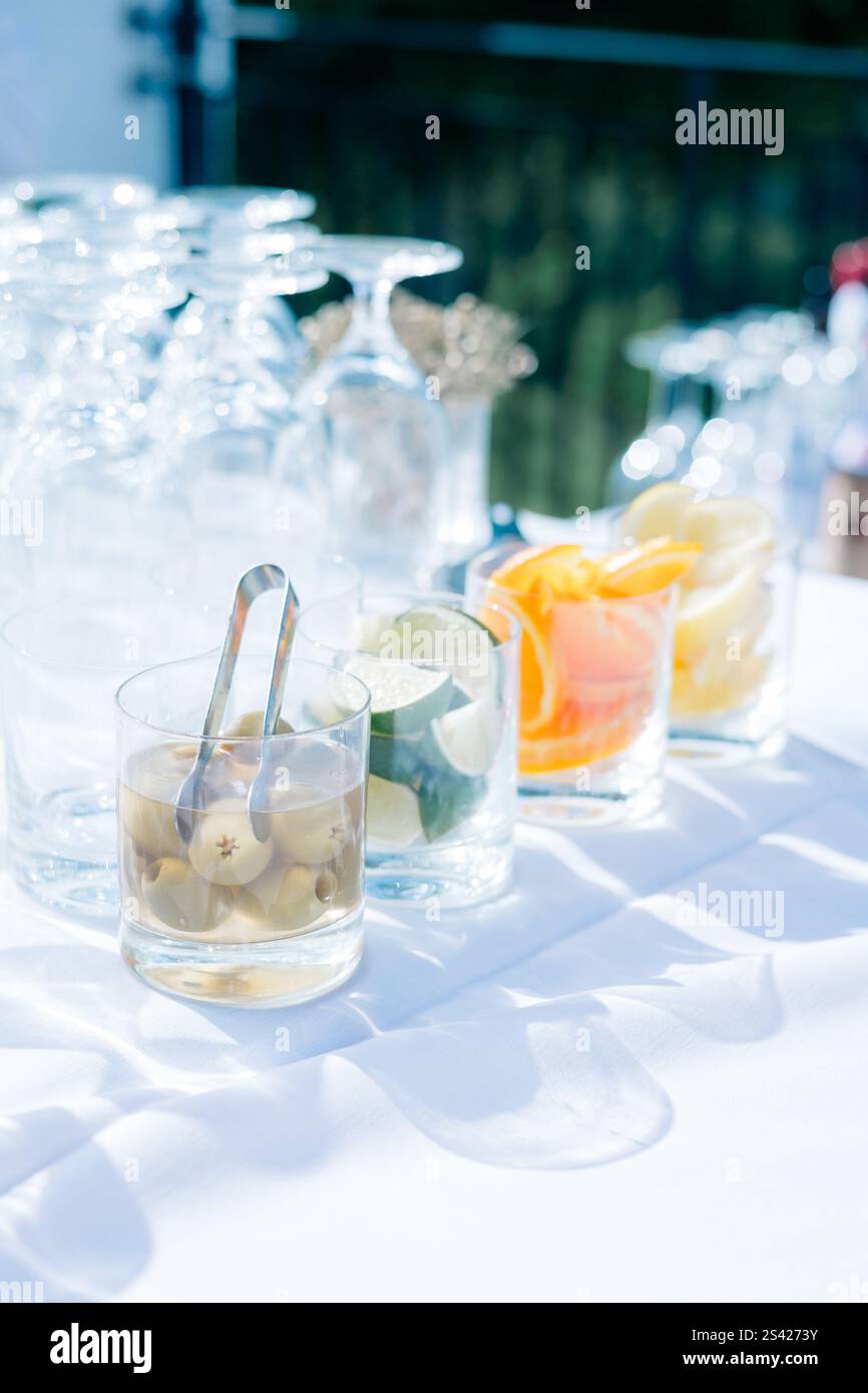 Outdoor bar setup with garnishes and glassware in natural light Stock ...