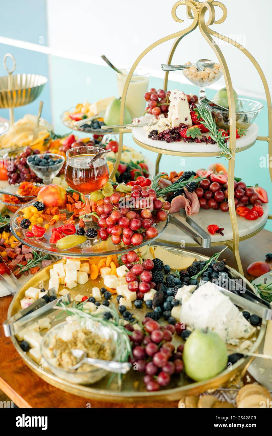 Luxurious charcuterie display with fruits, cheeses, and garnishes Stock ...