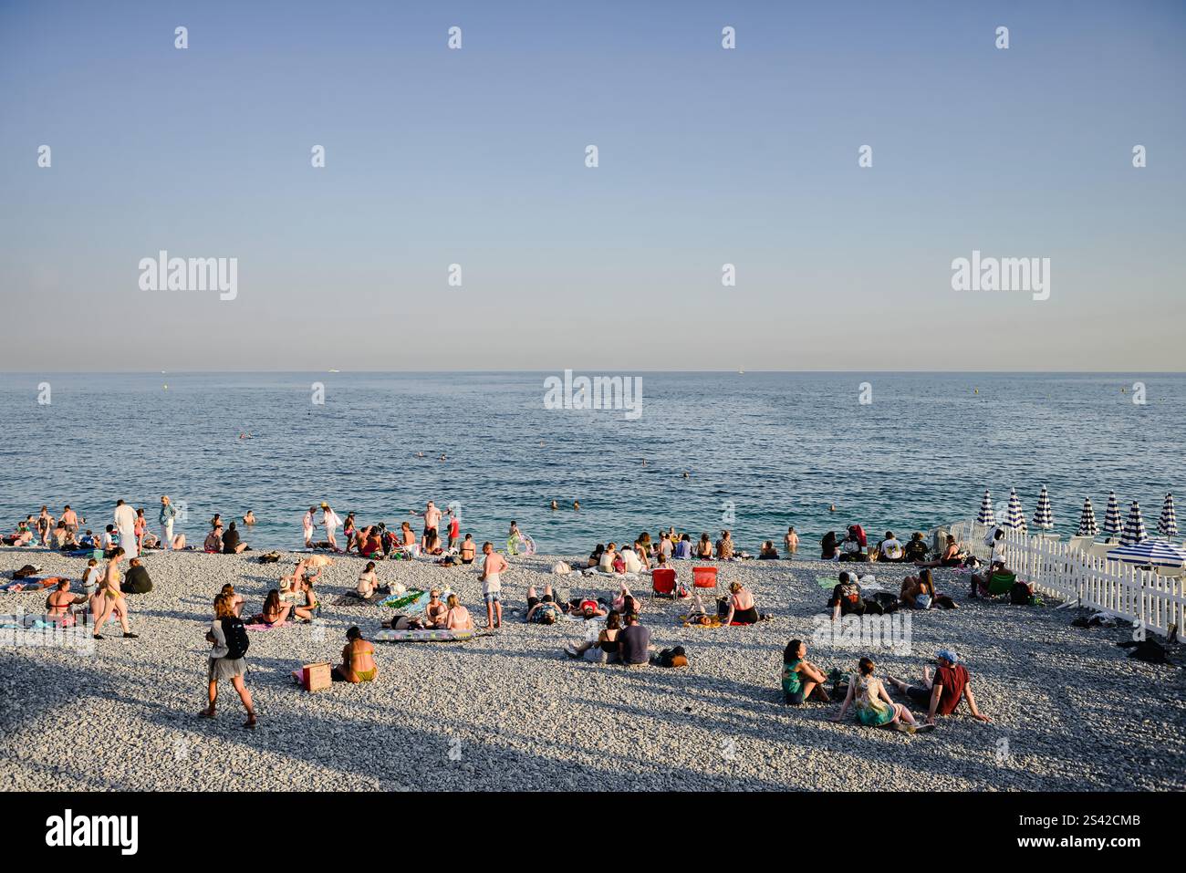 Relaxing at the Pebble Beach in Nice, France Stock Photo - Alamy