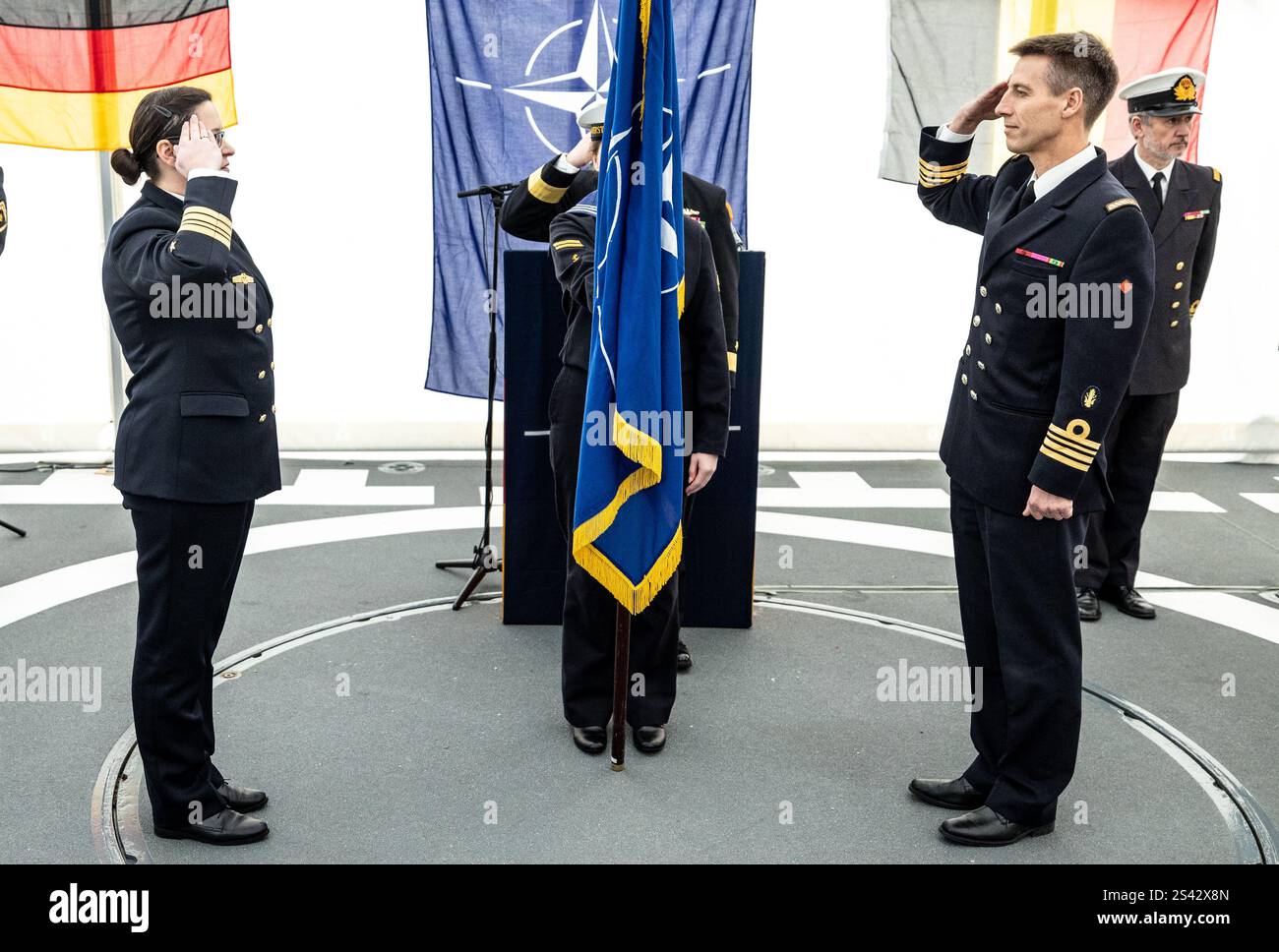Kiel, Germany. 10th Jan, 2025. Frigate Captain Beata Król (l) hands ...