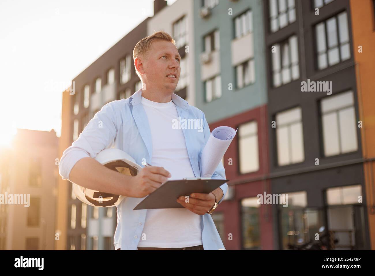 Male architect or builder inspecting and examining safety of ready new ...
