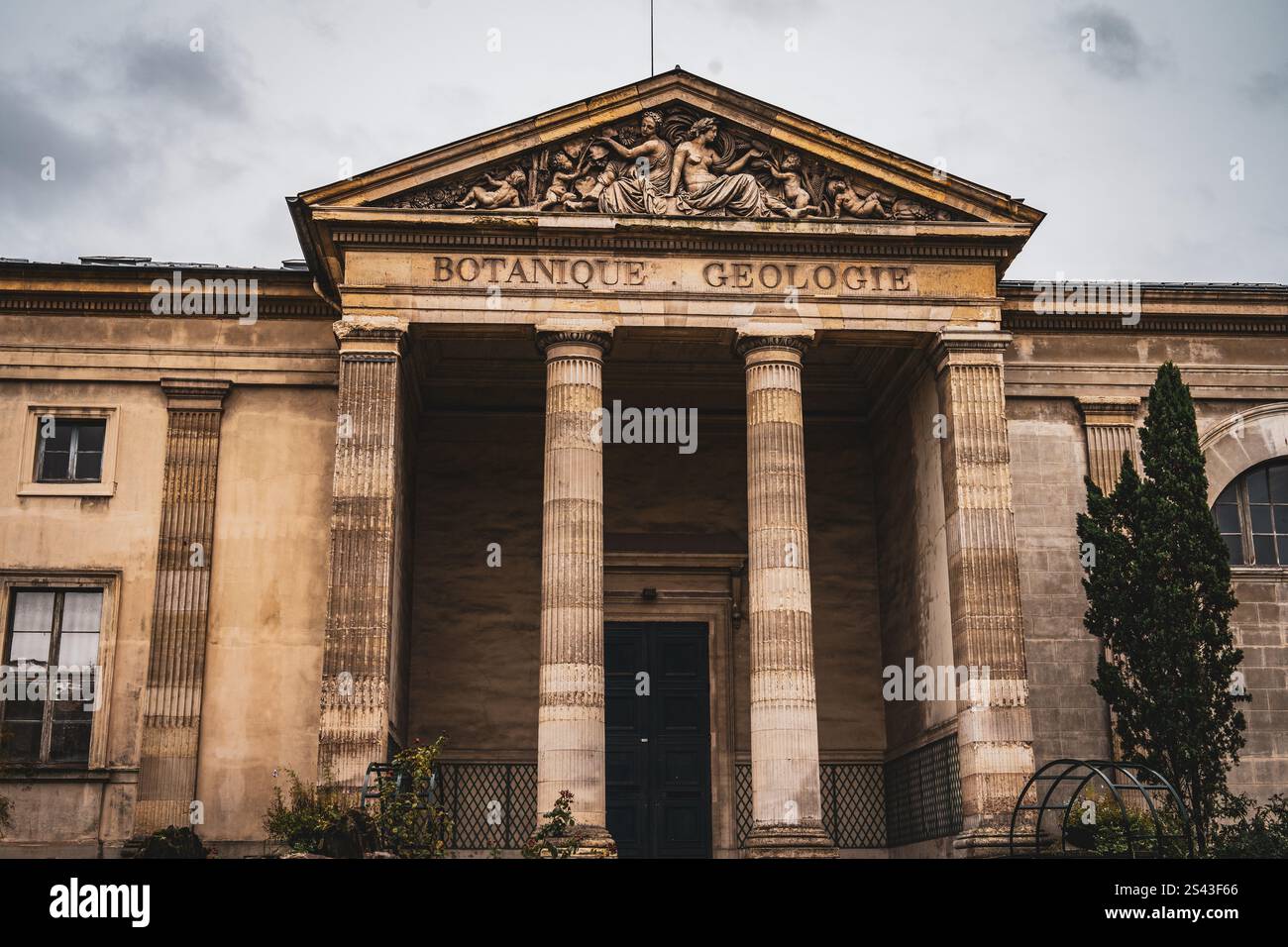 Historic botanical and geology building surrounded by dramatic sky ...