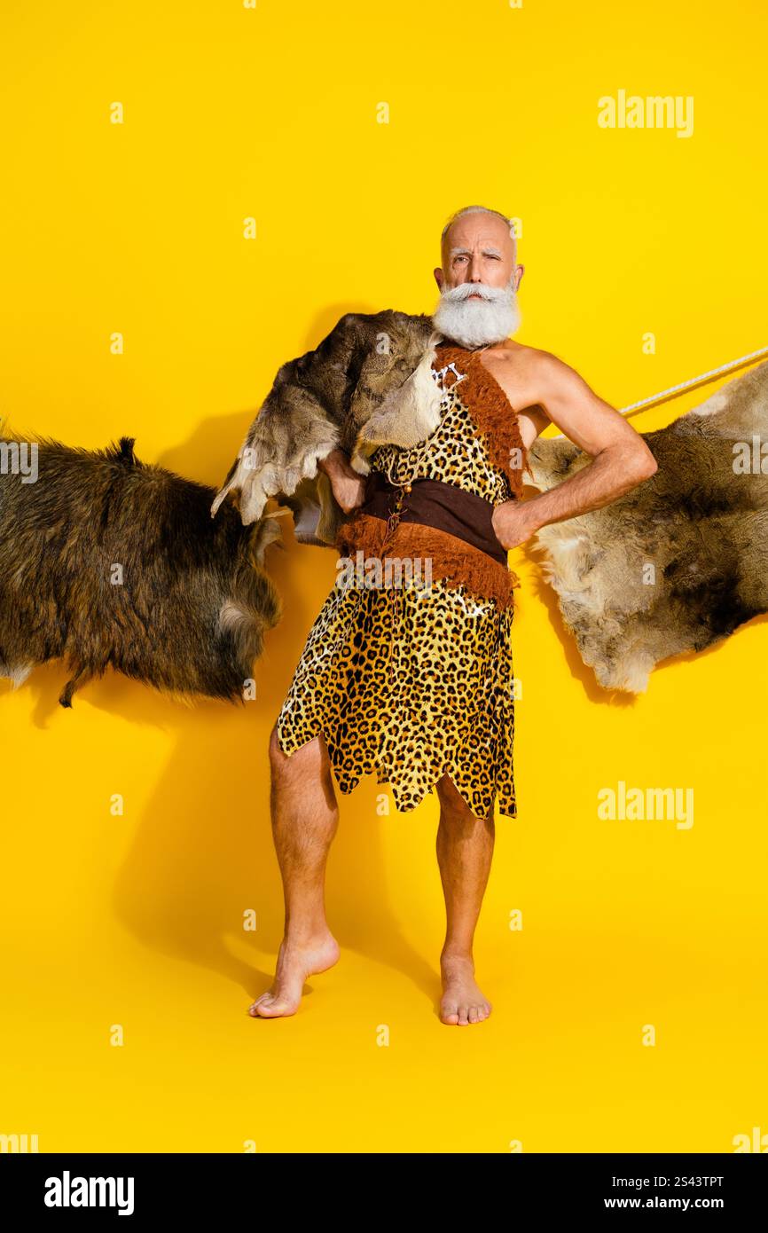 Vertical full length photo of confident barbarian guy dressed leopard ...