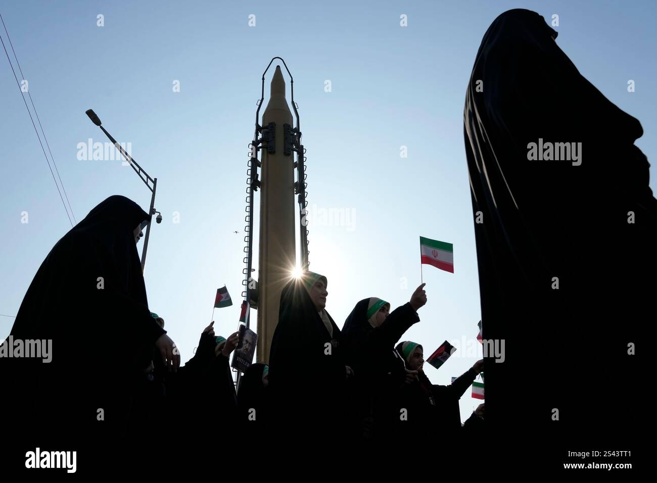 Members of the Iranian Basij paramilitary force march as a domestically ...