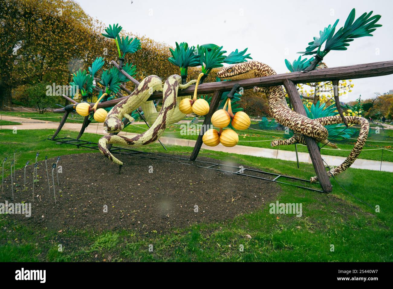 Creative installation with large snake and fruit sculptures in public ...