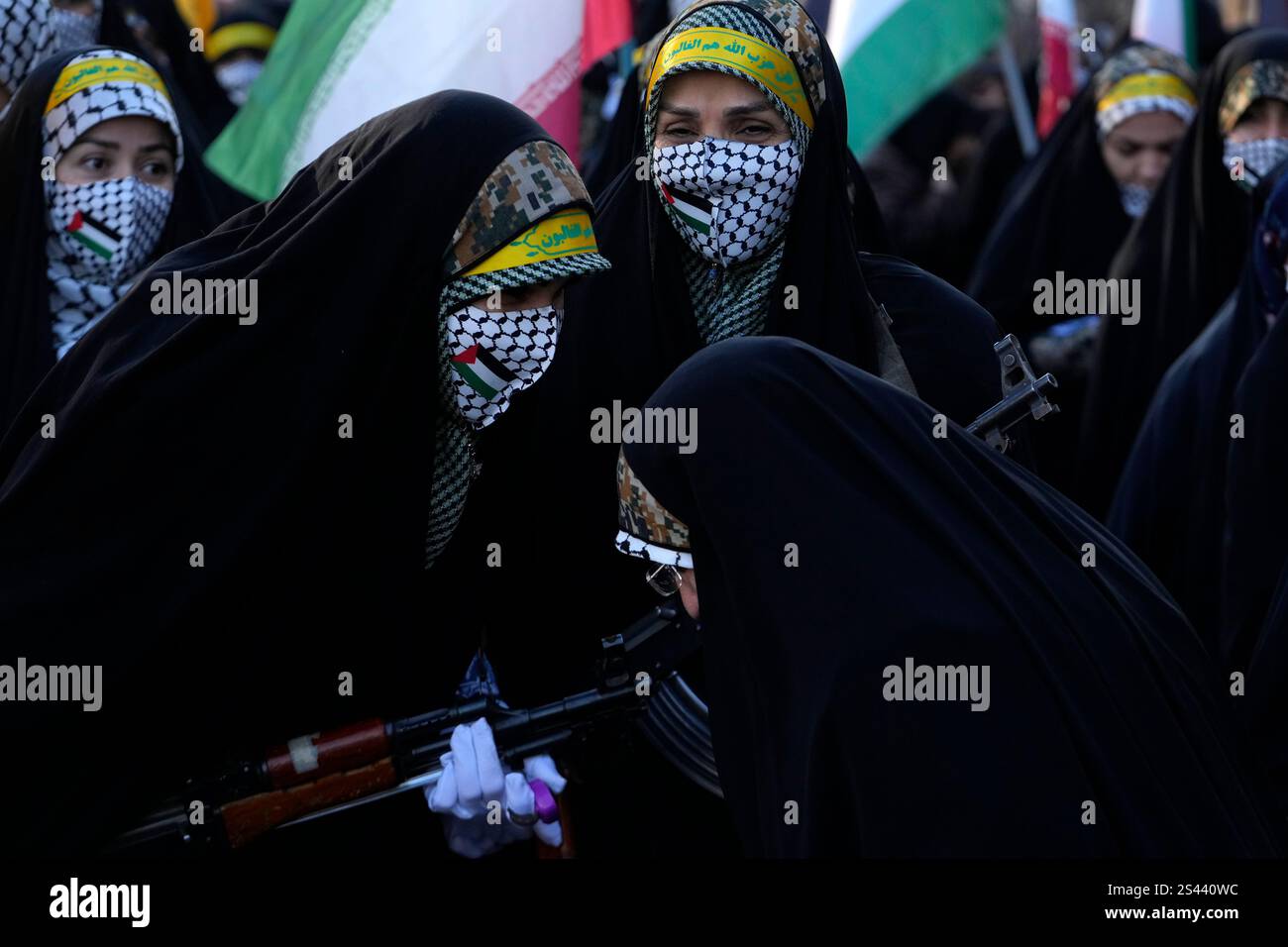Members of the Iranian Basij paramilitary force share a laugh prior to ...