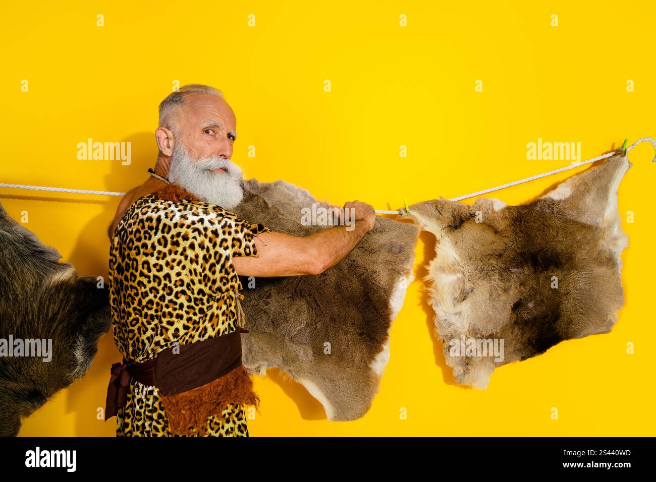 Photo of serious barbarian guy dressed leopard fur hunting animals ...