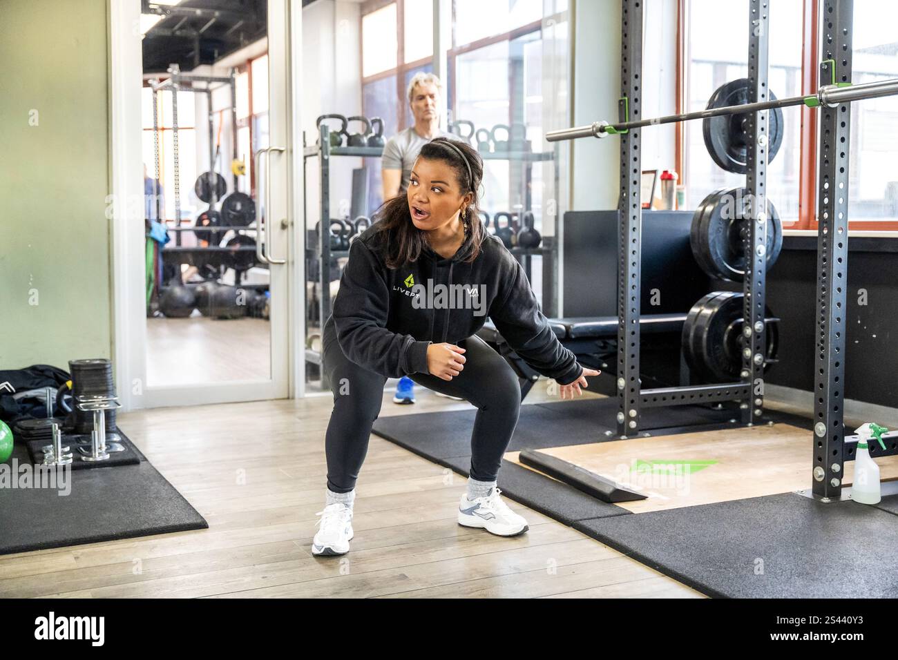 DEN HAAG - A trainer demonstrates the exercise at a gym in Scheveningen ...