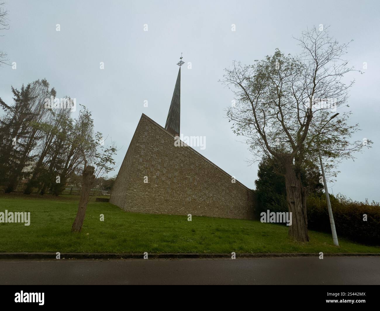 Modern church building with a distinctive triangular shape and tall ...