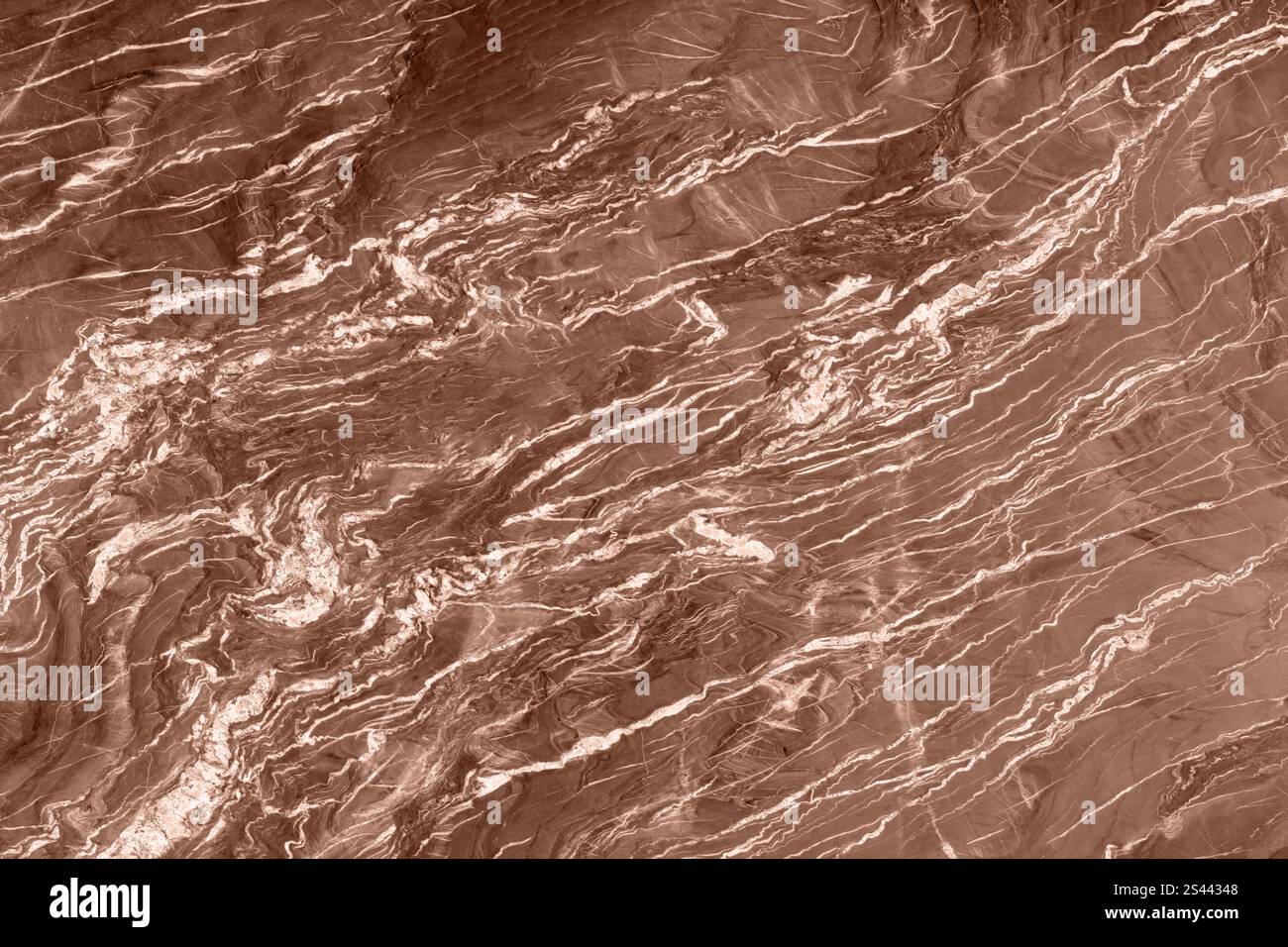 Close-up of granite in Mocha Mousse, Pantone's 2025 color, highlighting ...