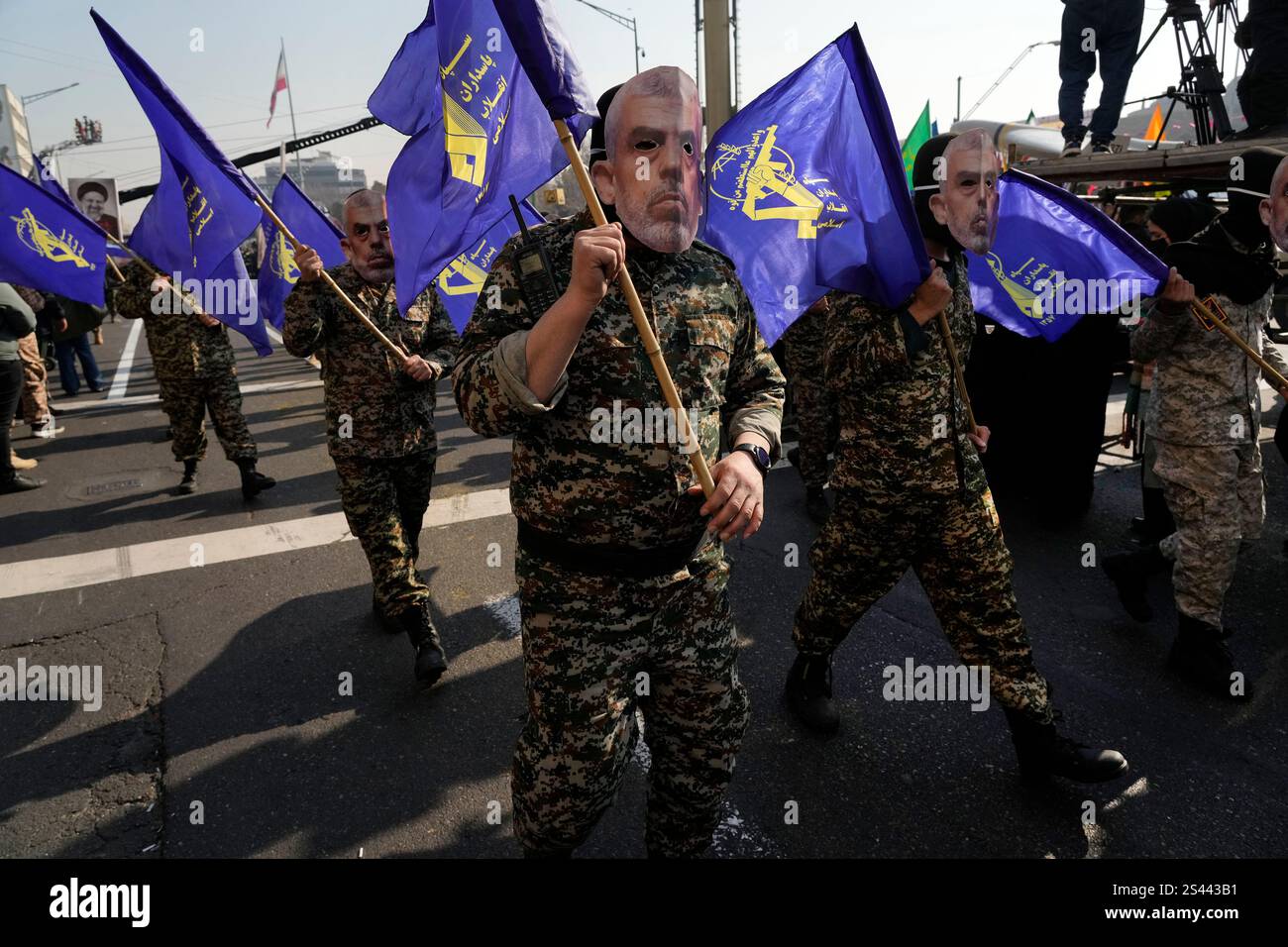 Members of the Iranian Basij paramilitary force carry the Revolutionary ...