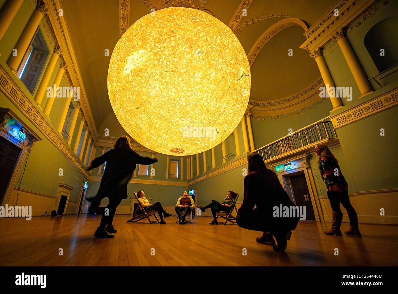 Staff at Bath Assembly Rooms admire the latest Luke Jerram astronomical ...