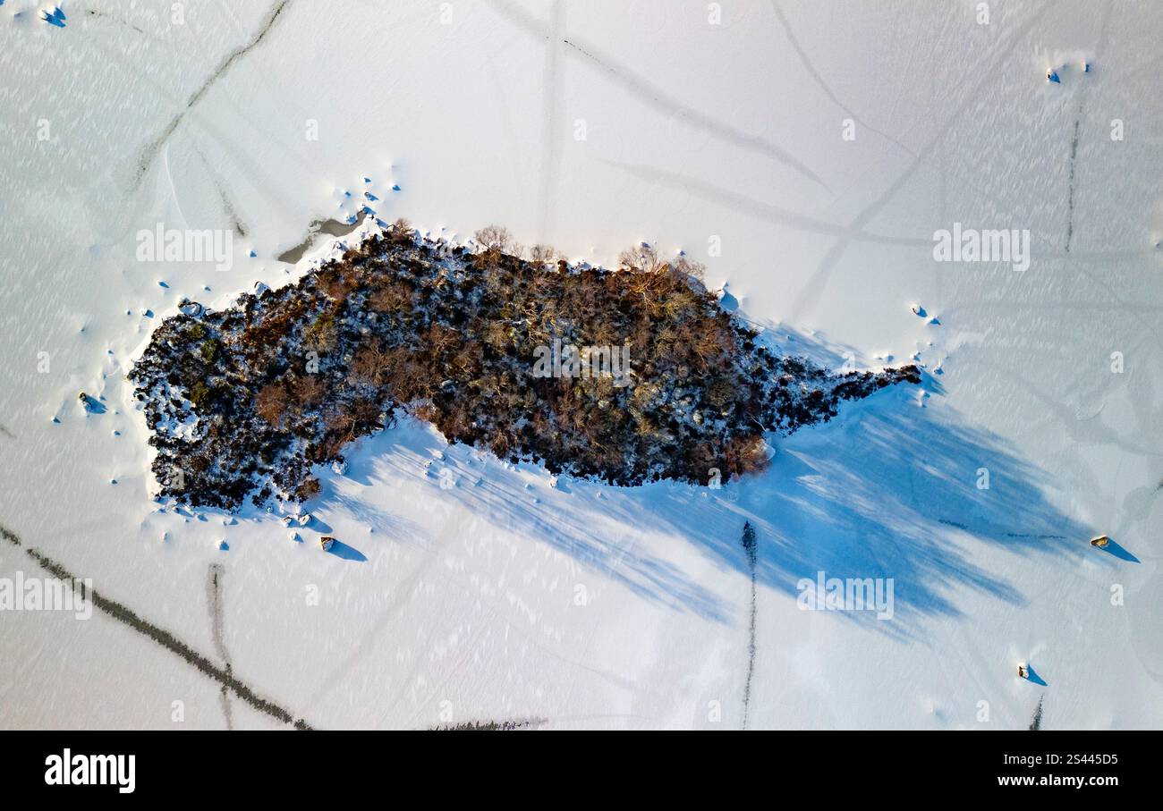 Sub zero temperatures in the Scottish Highlands cause the small lochs ...