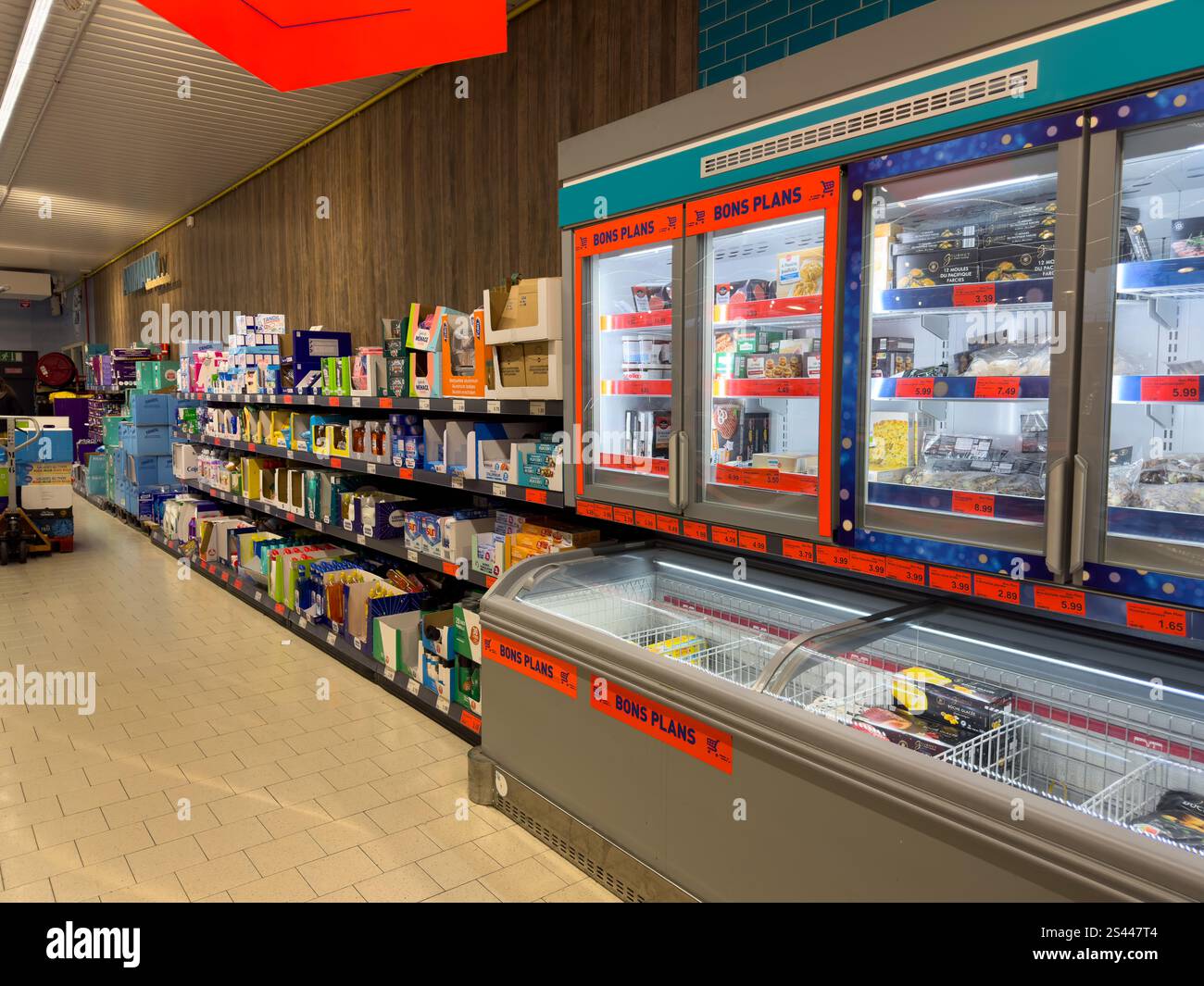 A bustling supermarket aisle showcasing various products, frozen ...