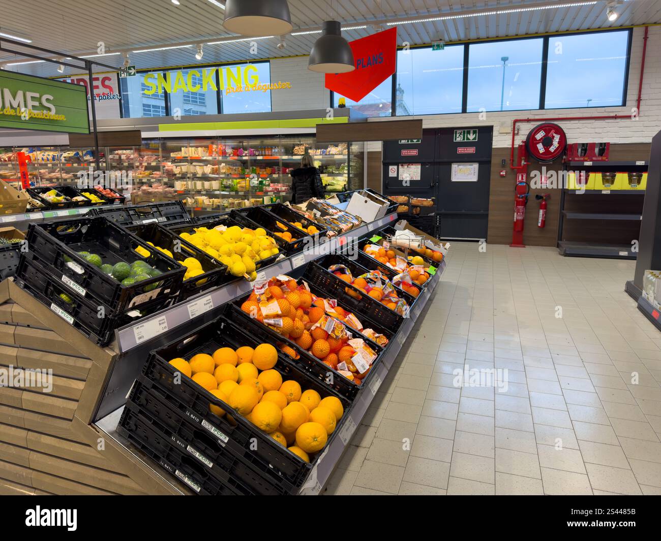 Fresh fruits displayed in a grocery store with vibrant colors and an ...