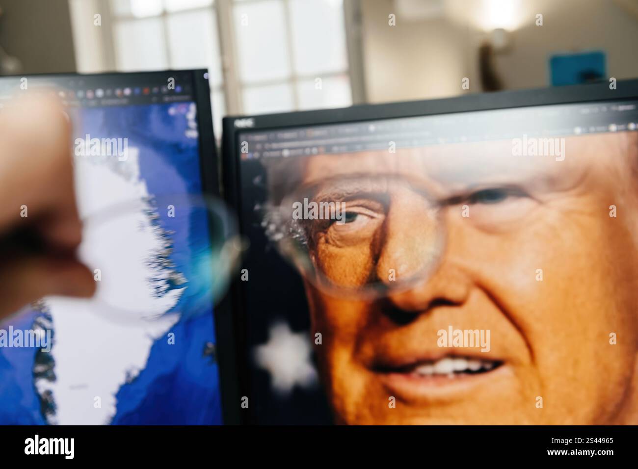 Paris, France - Jan 1, 2025: A pair of glasses held in front of two ...