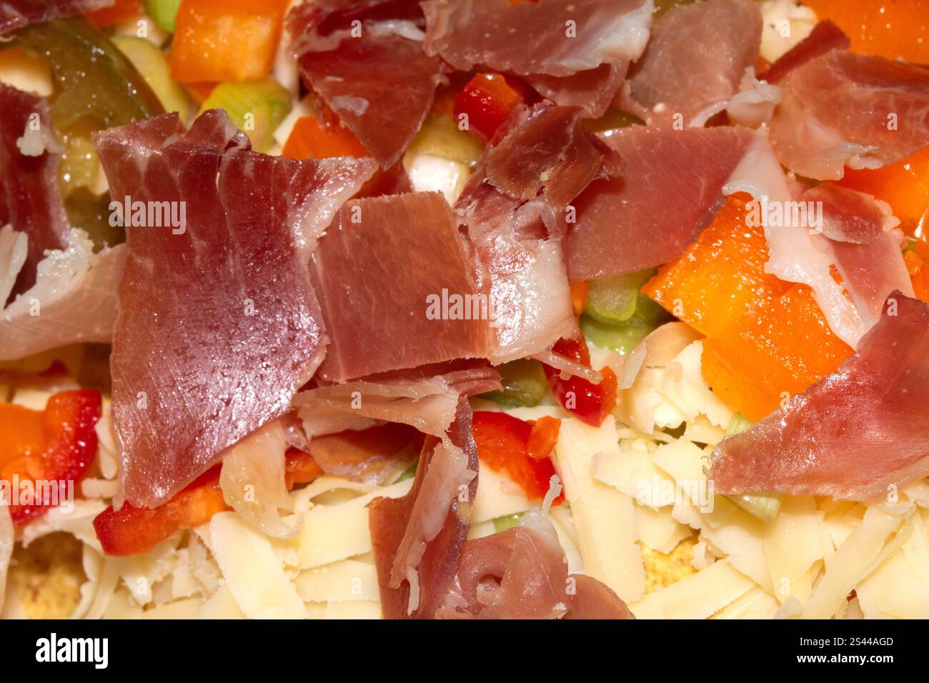 Loaded Nachos before being Cooked with Ham Cheese Jalapenos and Peppers ...