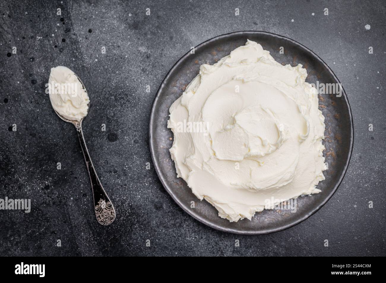 Creamy Homemade Mascarpone cheese, cream cheese. black background. top ...