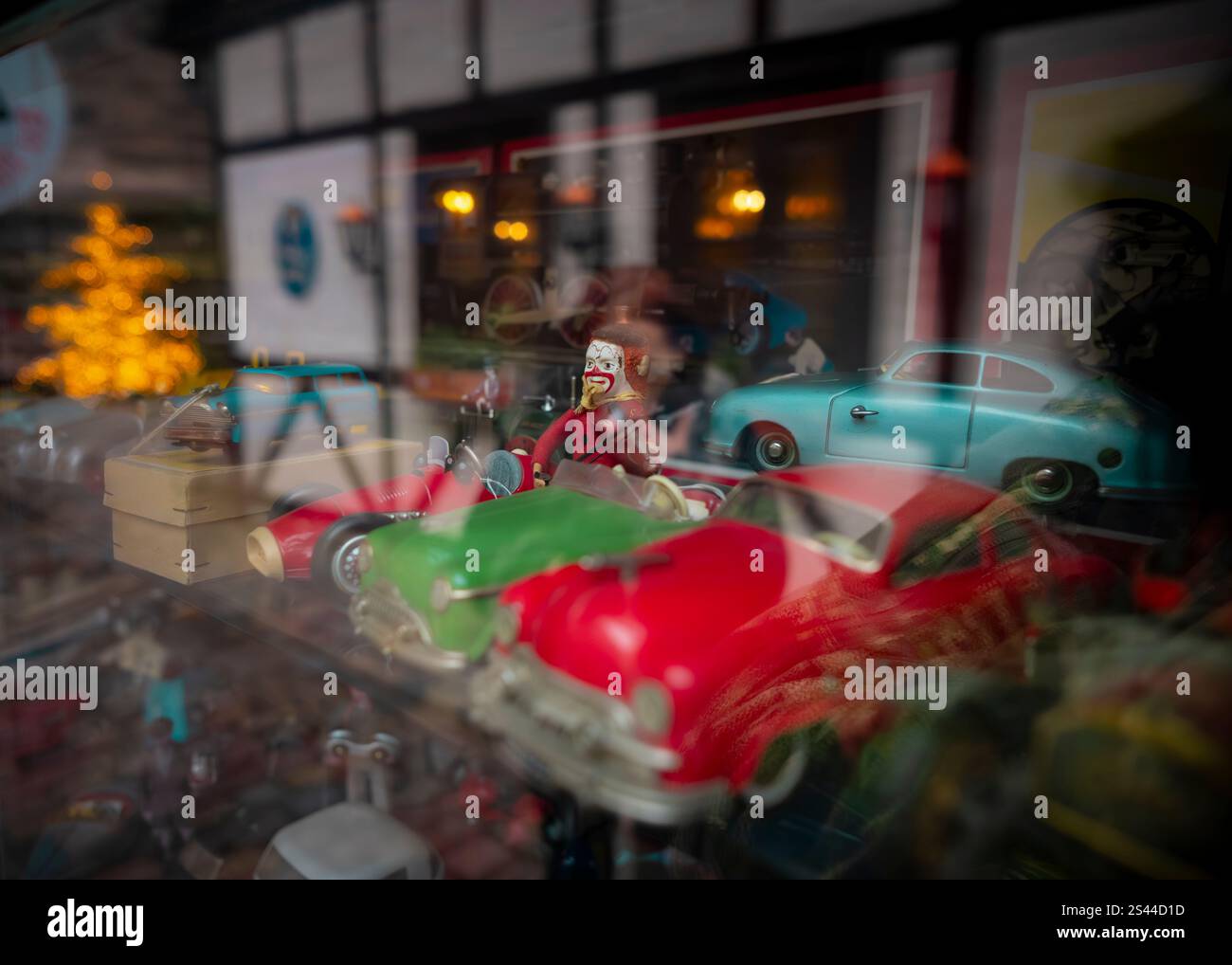 Showcase of vintage toy collection filled with colorful cars and a ...