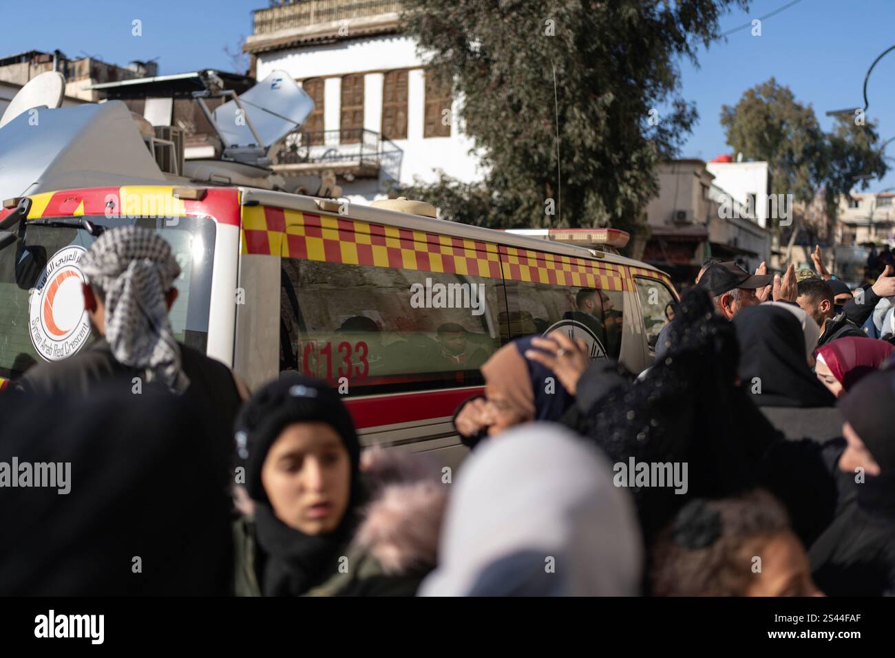 An ambulance waits outside the Umayyad Mosque after a stampede inside ...