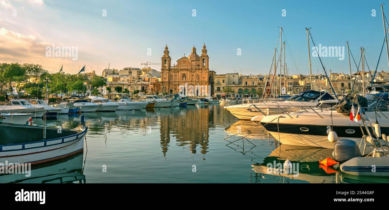 Panoramic view of marina boats and catholic parish church in Msida ...
